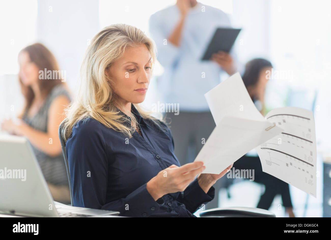 Reading document in office hi-res stock photography and images - Alamy