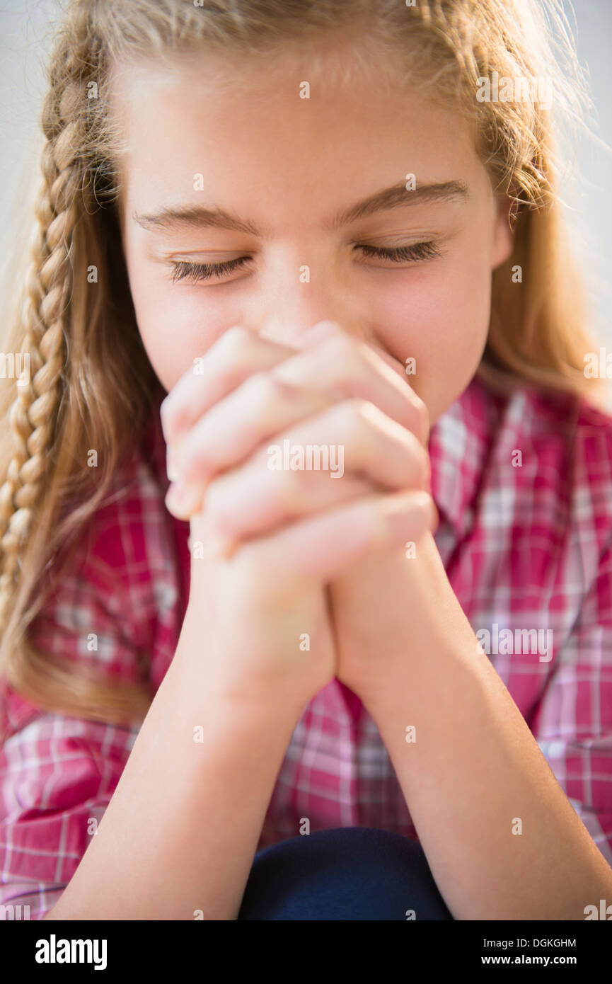 Portrait of praying girl (8-9 Stock Photo - Alamy