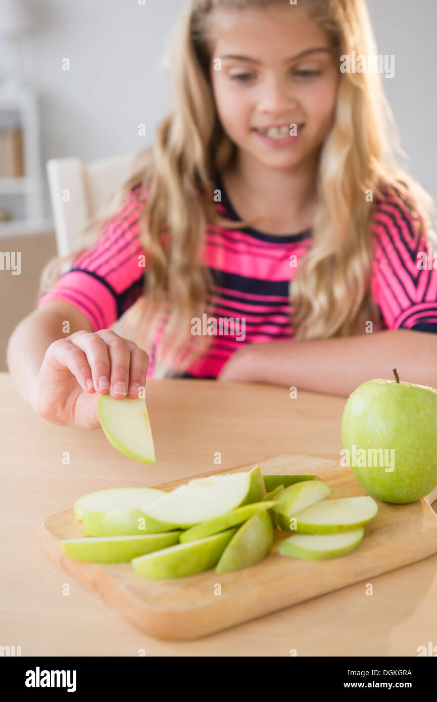 Child eating apple slice hi-res stock photography and images - Alamy