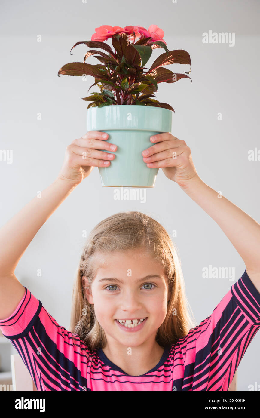 Flower pot girl hi-res stock photography and images - Alamy