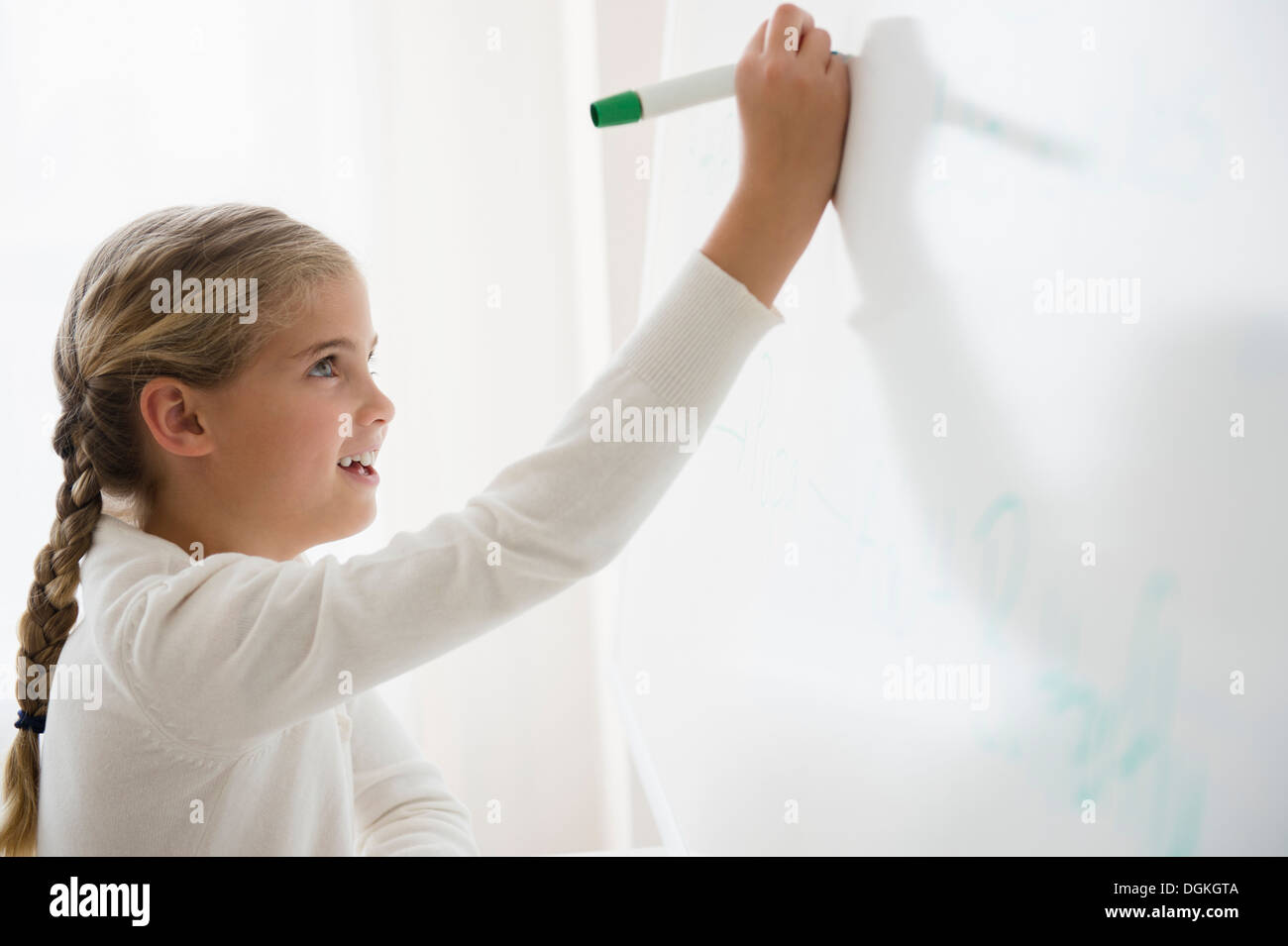 Girl writing on board hi-res stock photography and images - Alamy