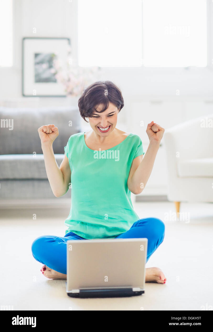 Barefoot woman using laptop in hi-res stock photography and images - Alamy
