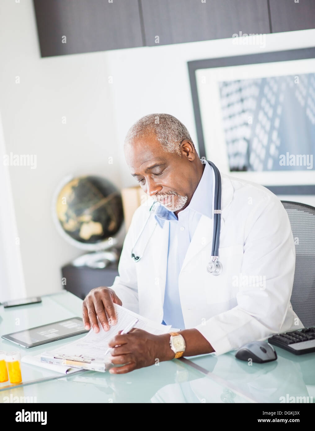 Portrait of doctor holding prescription Stock Photo - Alamy