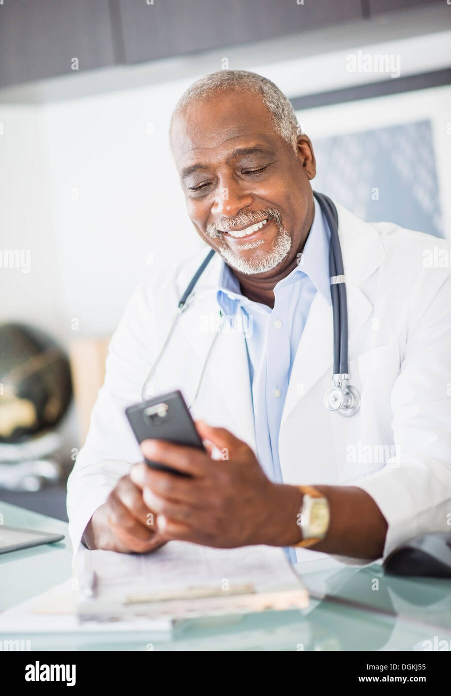 Portrait african man text messaging hi-res stock photography and images ...