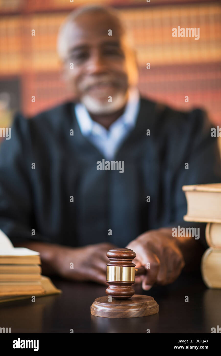 Judge holding gavel in courtroom Stock Photo - Alamy