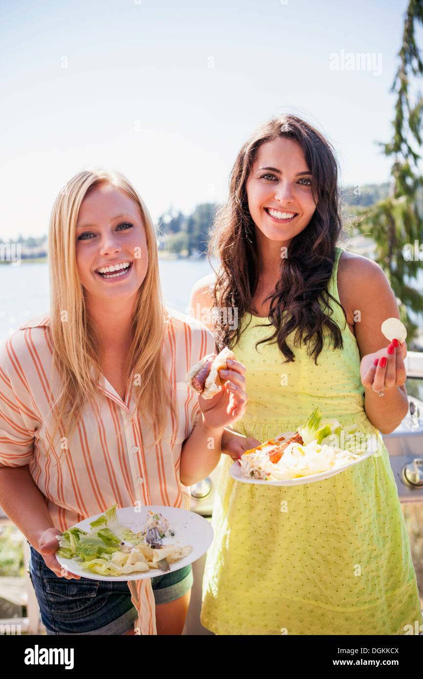 USA, Washington, Bellingham, Young women enjoying barbecue Stock Photo ...