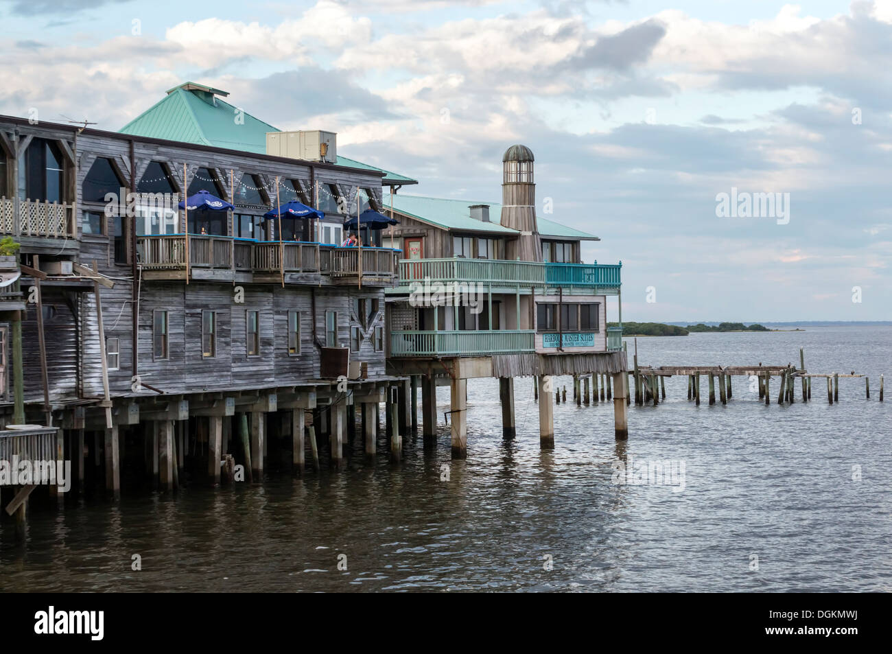 Weathered wood frame buildings constructed on piling stilts along the ...