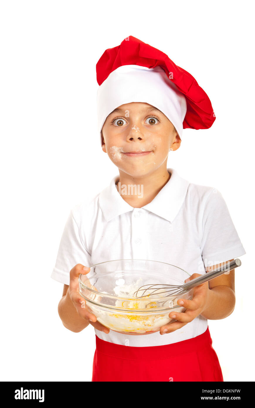 Amazed chef boy holding dough isolated on white background Stock Photo ...