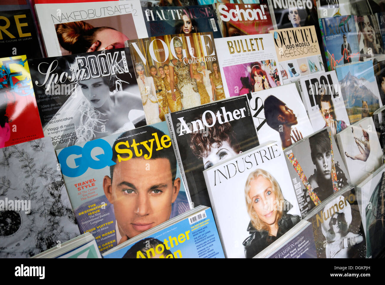Fashion magazine display in a shop window Stock Photo - Alamy