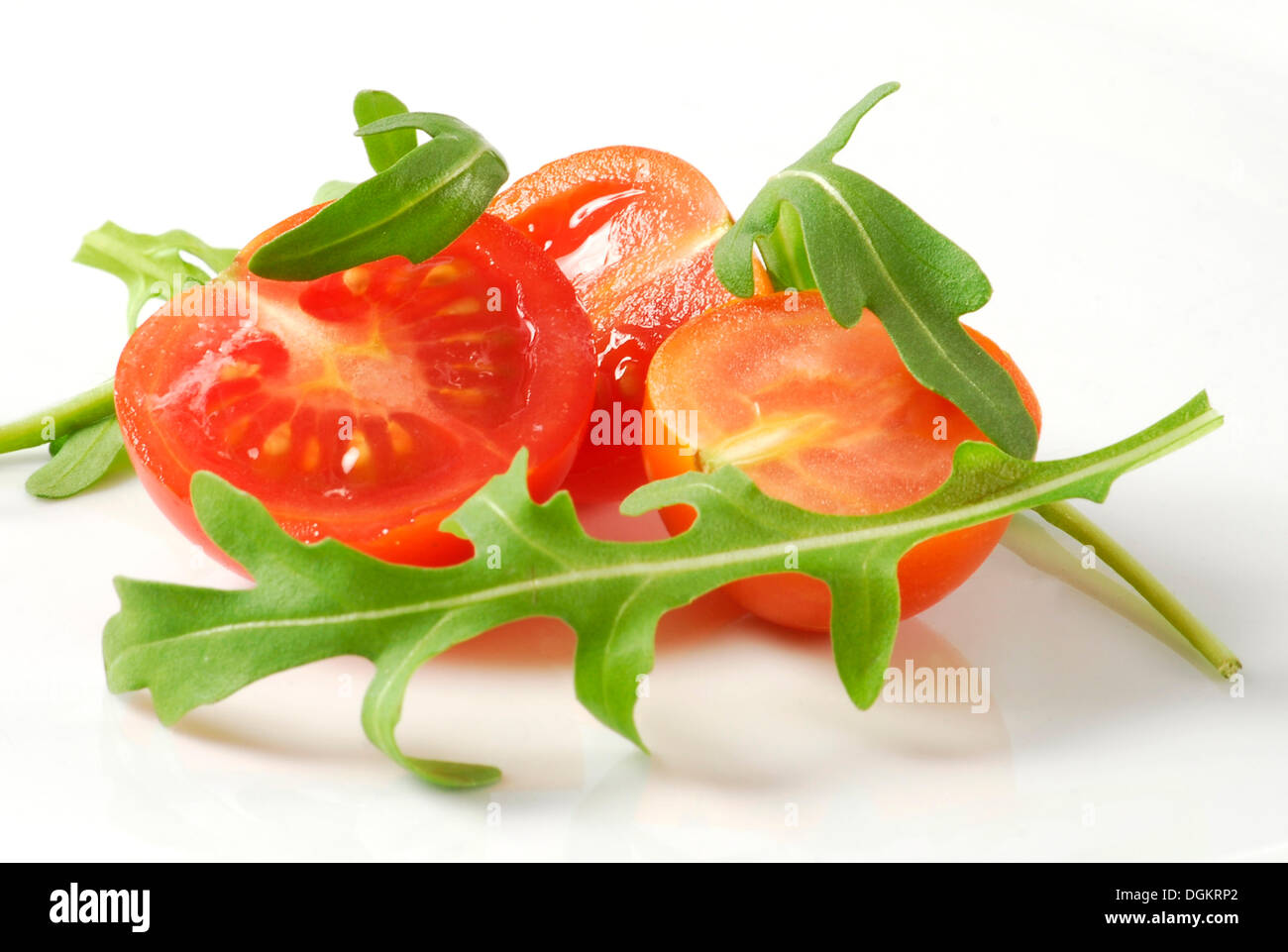 Tomatoes and rocket or arugula Stock Photo - Alamy