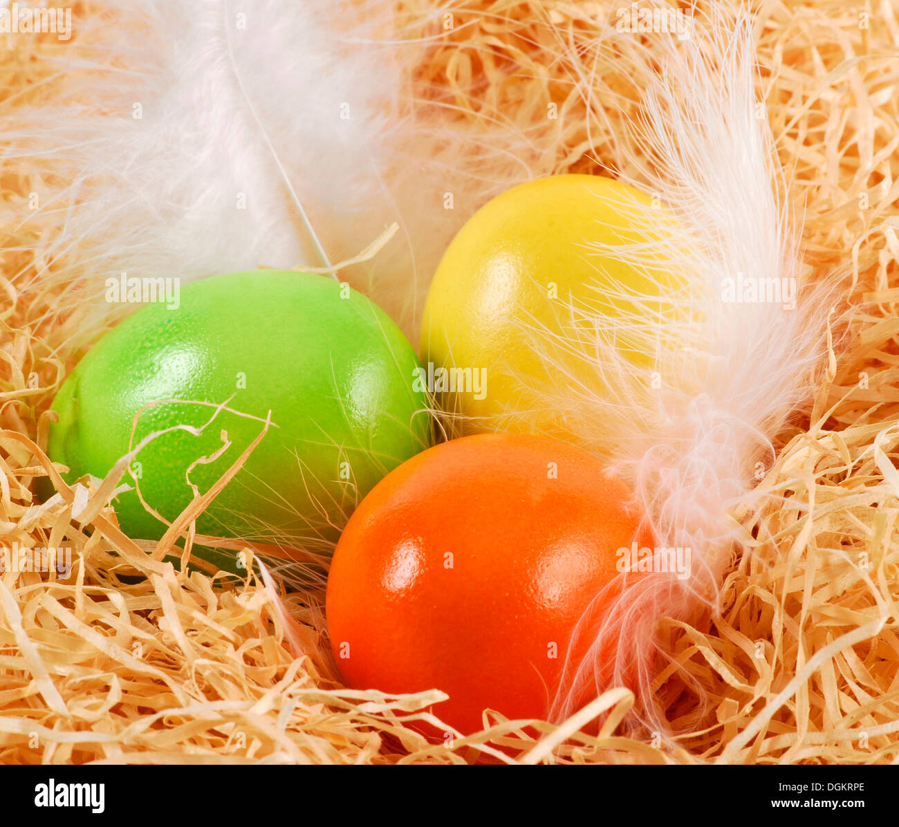 Three Easter eggs in an Easter basket Stock Photo - Alamy
