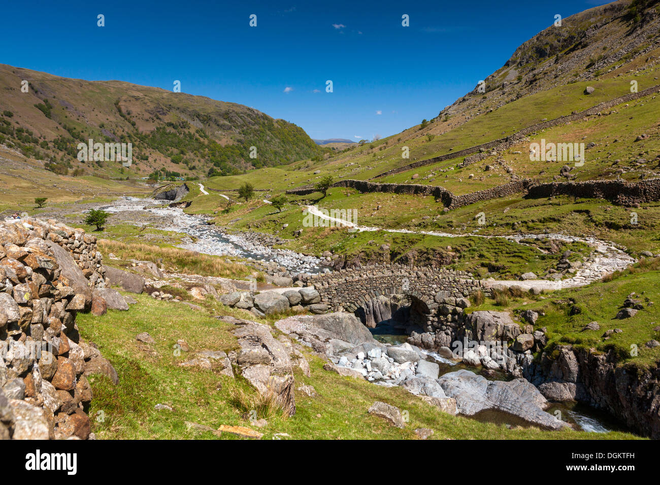 Stockley Bridge which is a traditional packhorse bridge over Grains ...