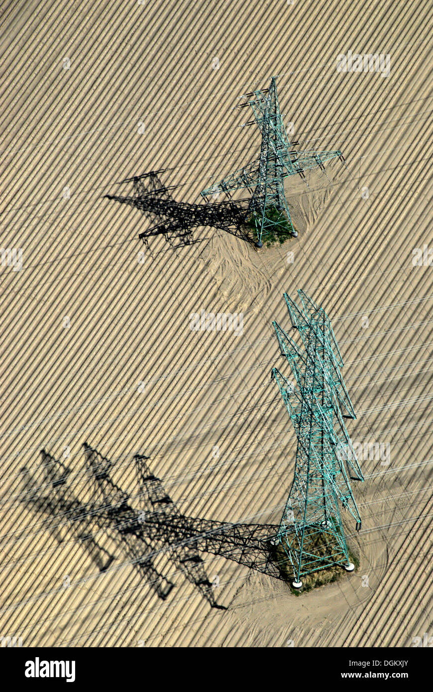 Aerial view, high-voltage transmission masts in a field, Geesthacht ...
