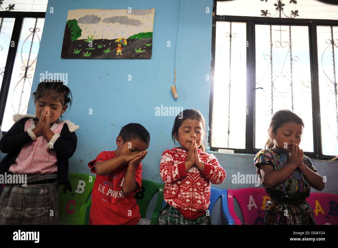 Preschoolers pray before activities to celebrate National Children's ...