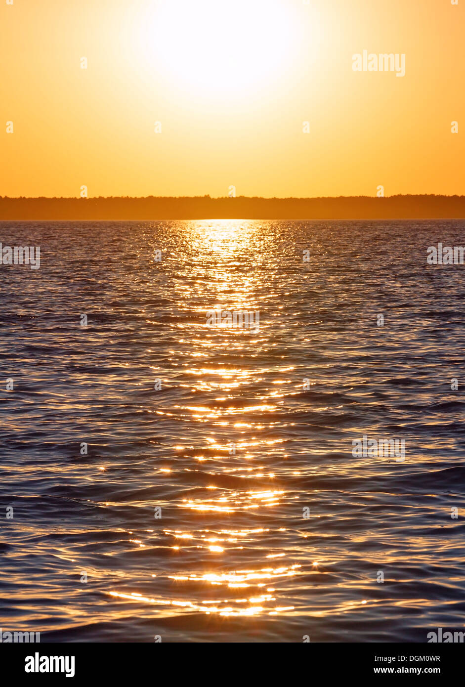 Sunset and sun track on summer lake surface Stock Photo - Alamy
