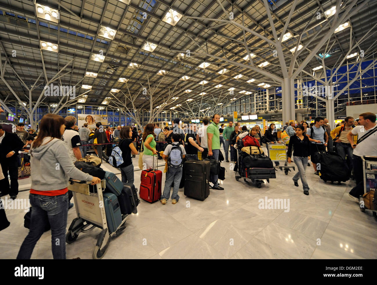 Passengers waiting in line at the check-in, Stuttgart Airport, Baden ...
