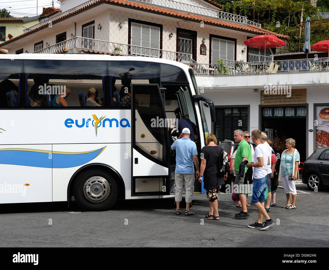 Madeira Portugal. A group of tourists boarding a tour bus in the ...