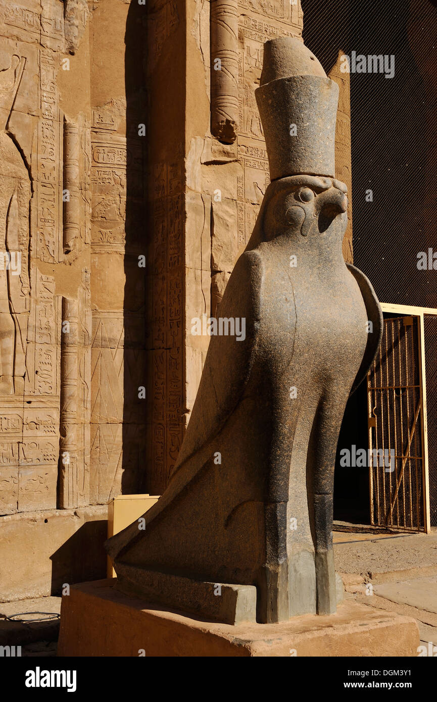 Colossal black granite statue of Horus at entrance to Hypostyle Hall ...