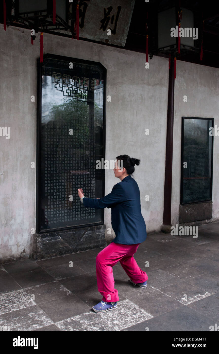 Woman practicing Taijiquan (tai chi) in Yuyuan Garden (Garden of ...