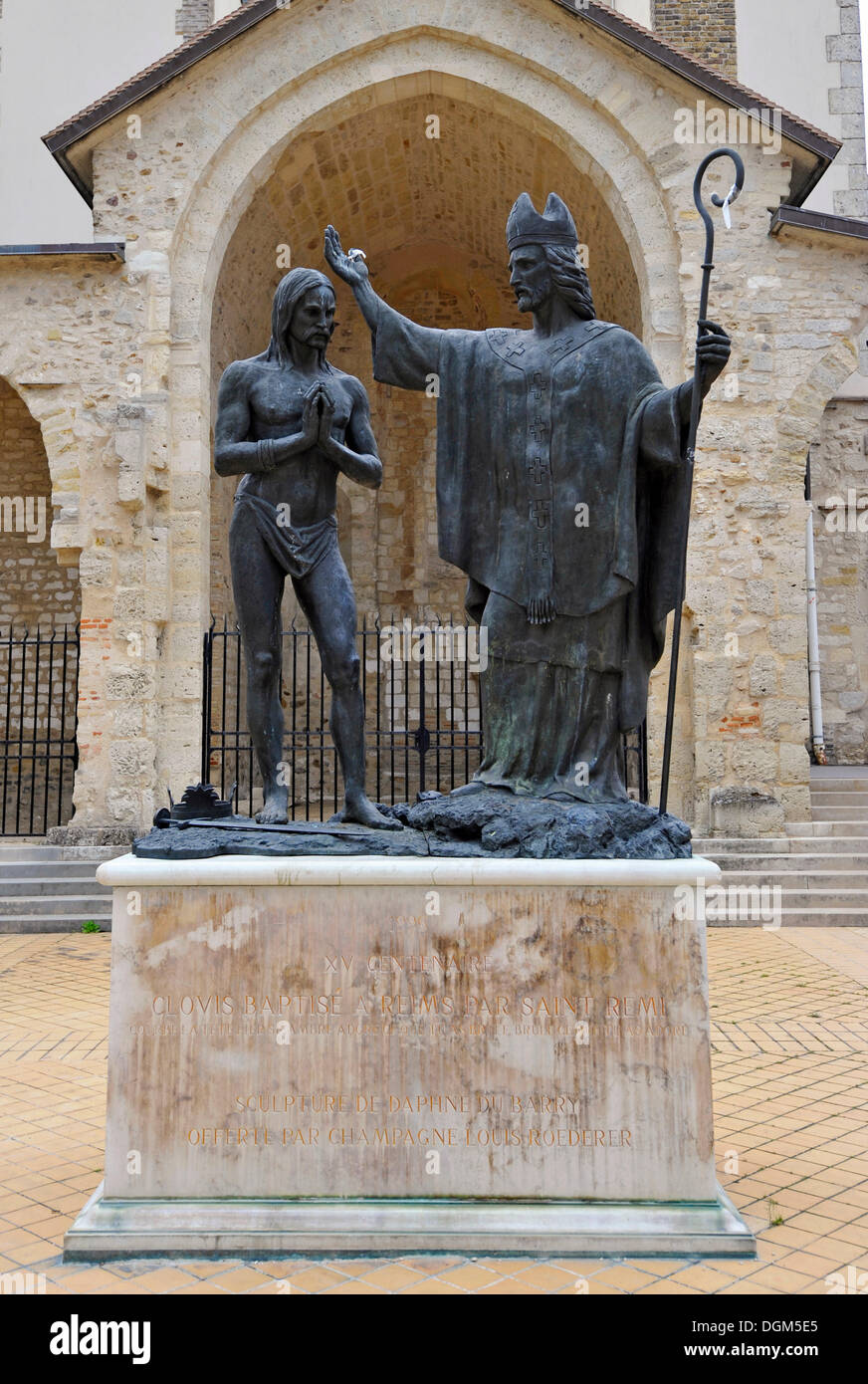 Statue of St. Remigius baptizing King Clovis in front of Saint-Remi ...