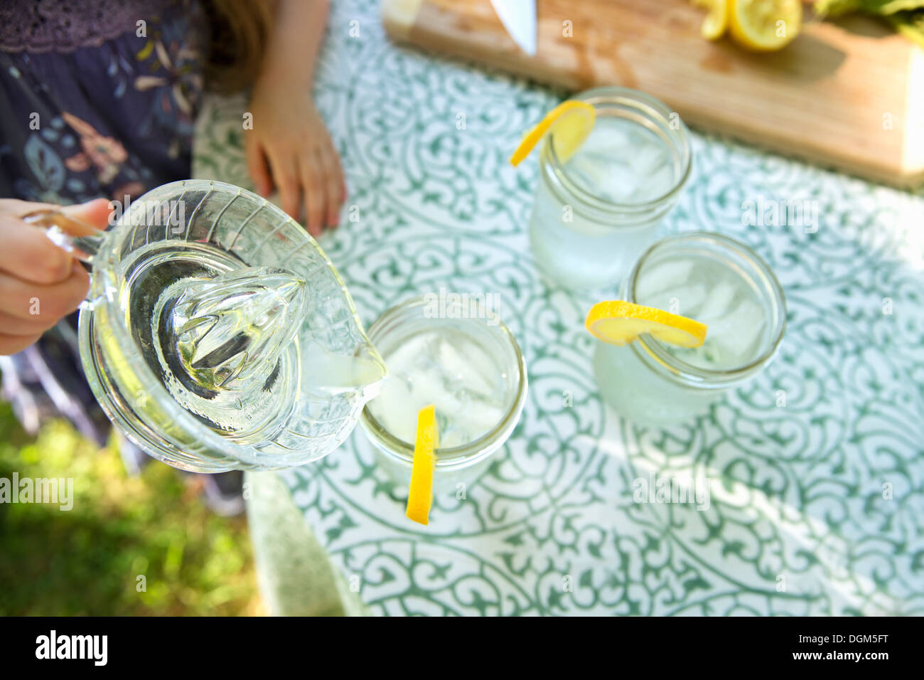 Child pouring lemonade hi-res stock photography and images - Alamy