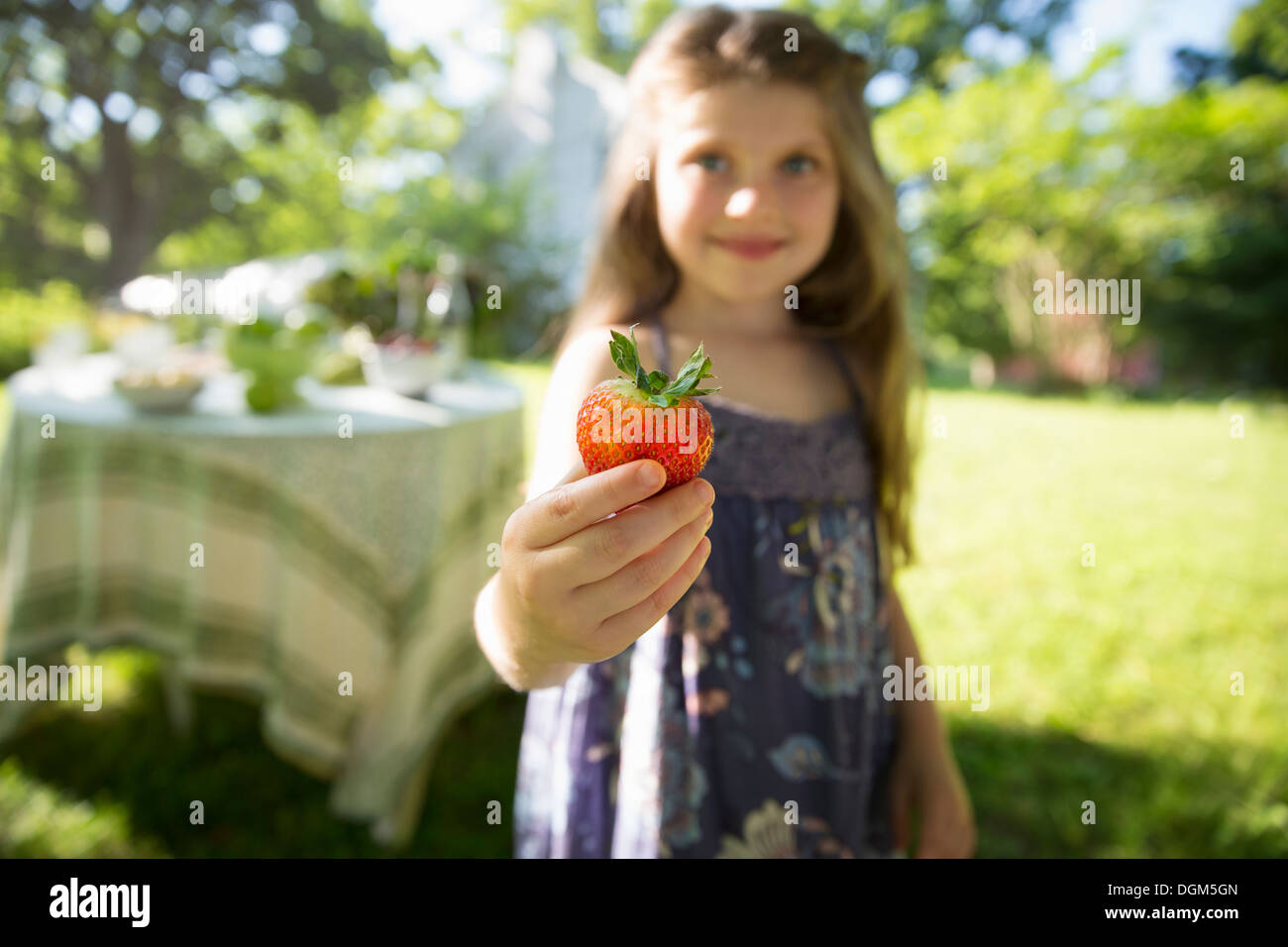 Girl holding fruit hi-res stock photography and images - Alamy