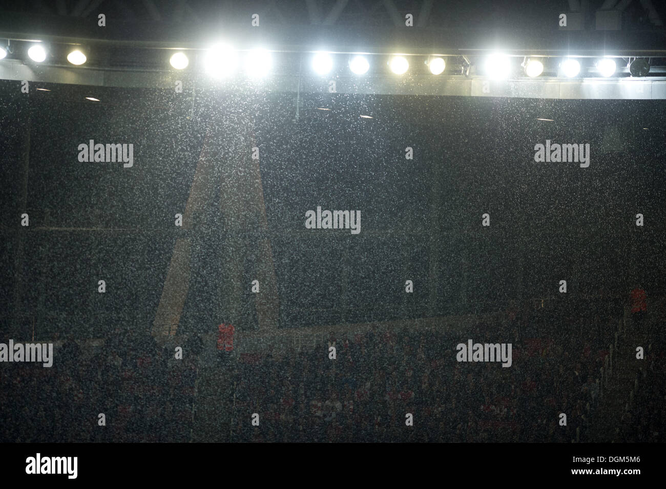 London, UK. 22nd Oct, 2013. Raindrops are illuminated by spotlights ...