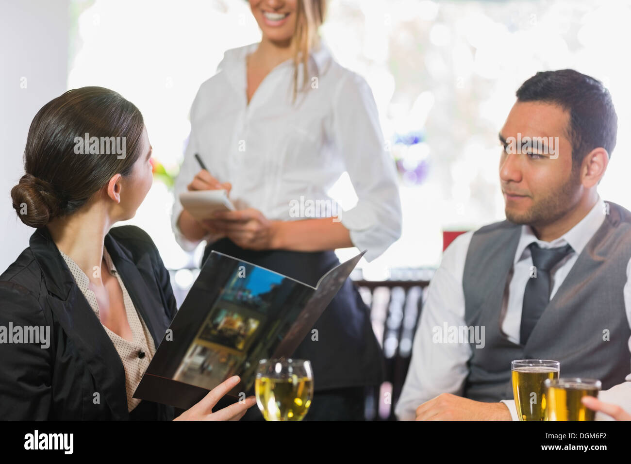 Woman ordering restaurant waitress hi-res stock photography and images ...