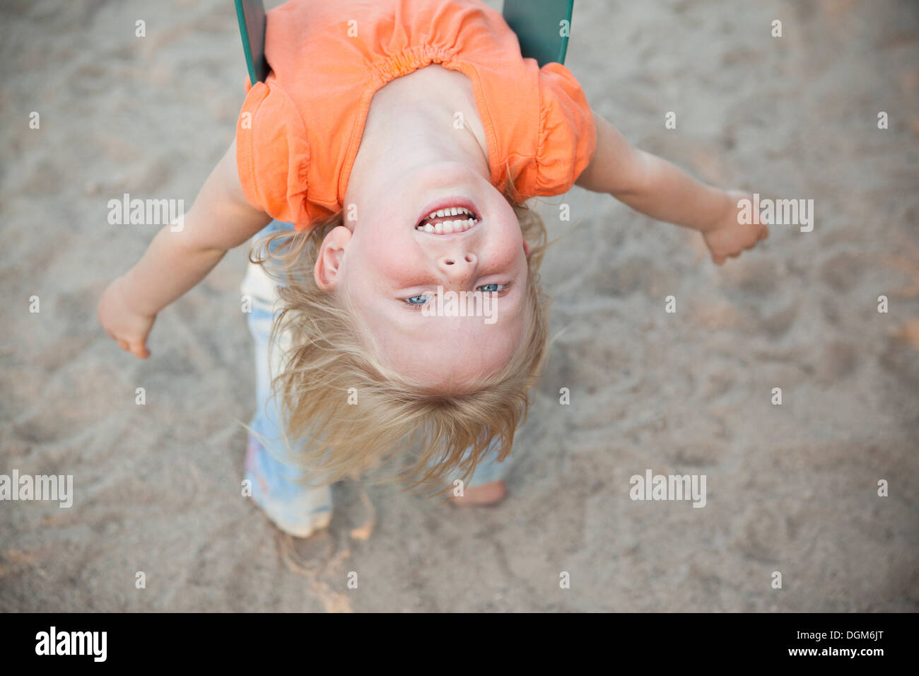 Girls hanging upside down hi-res stock photography and images - Alamy