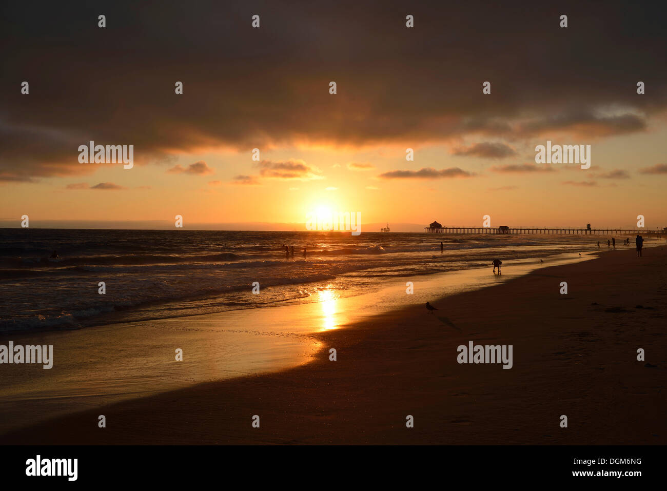 Entertainment pier, sunset, beach of Huntington Beach, California ...