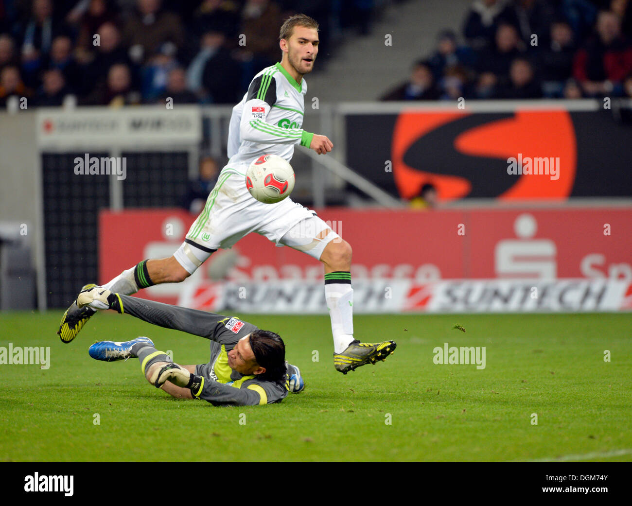 Bas DOST of VfL Wolfsburg, playing the ball, outplaying goalkeeper Tim ...
