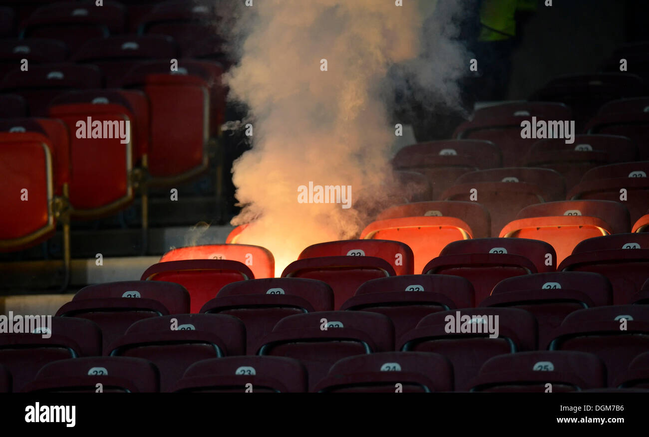 Row of seats going up in flames, flares, fireworks on the seats, fire ...