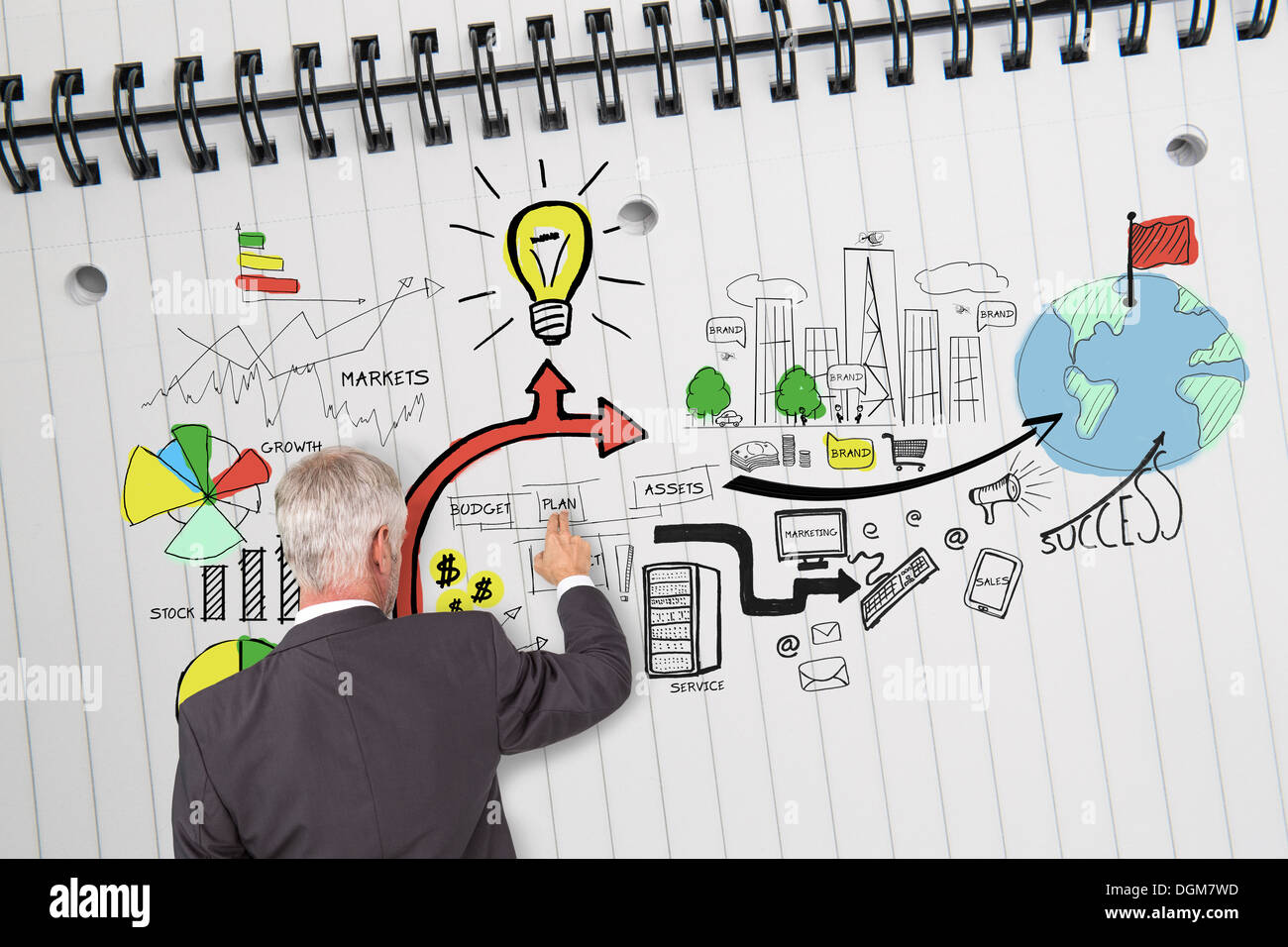 Rear view of businessman drawing economical graphics Stock Photo - Alamy