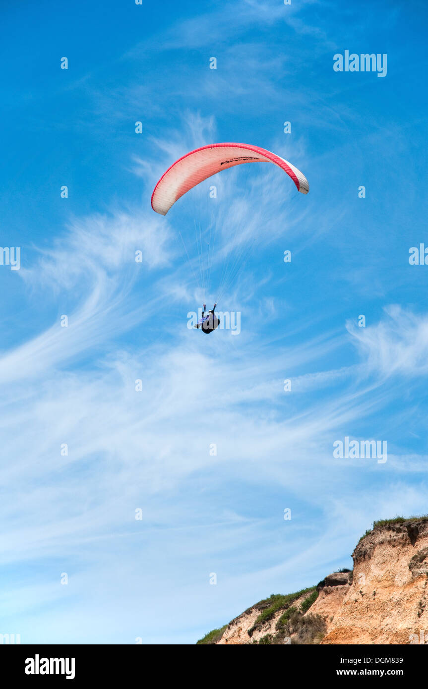 Portrait image of one person paragliding, seen from below isolated ...