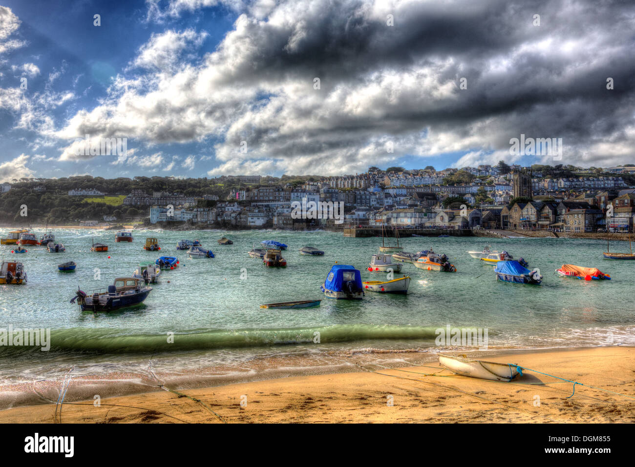 St Ives harbour Cornwall with dramatic sky and boats and sea on sunny ...