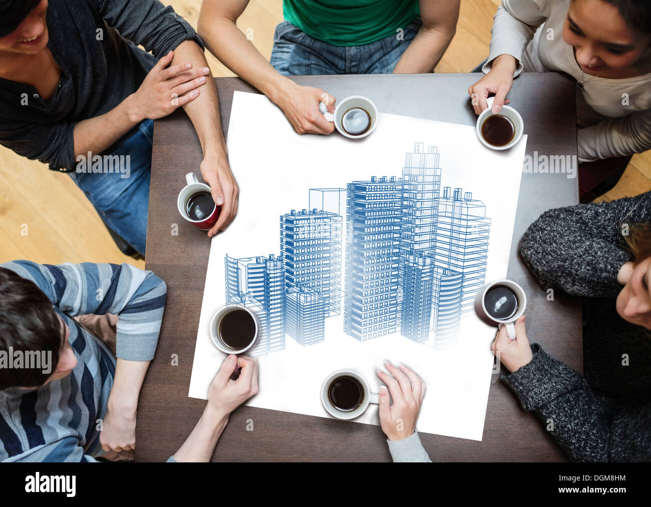 Overhead view of people sitting around table Stock Photo - Alamy