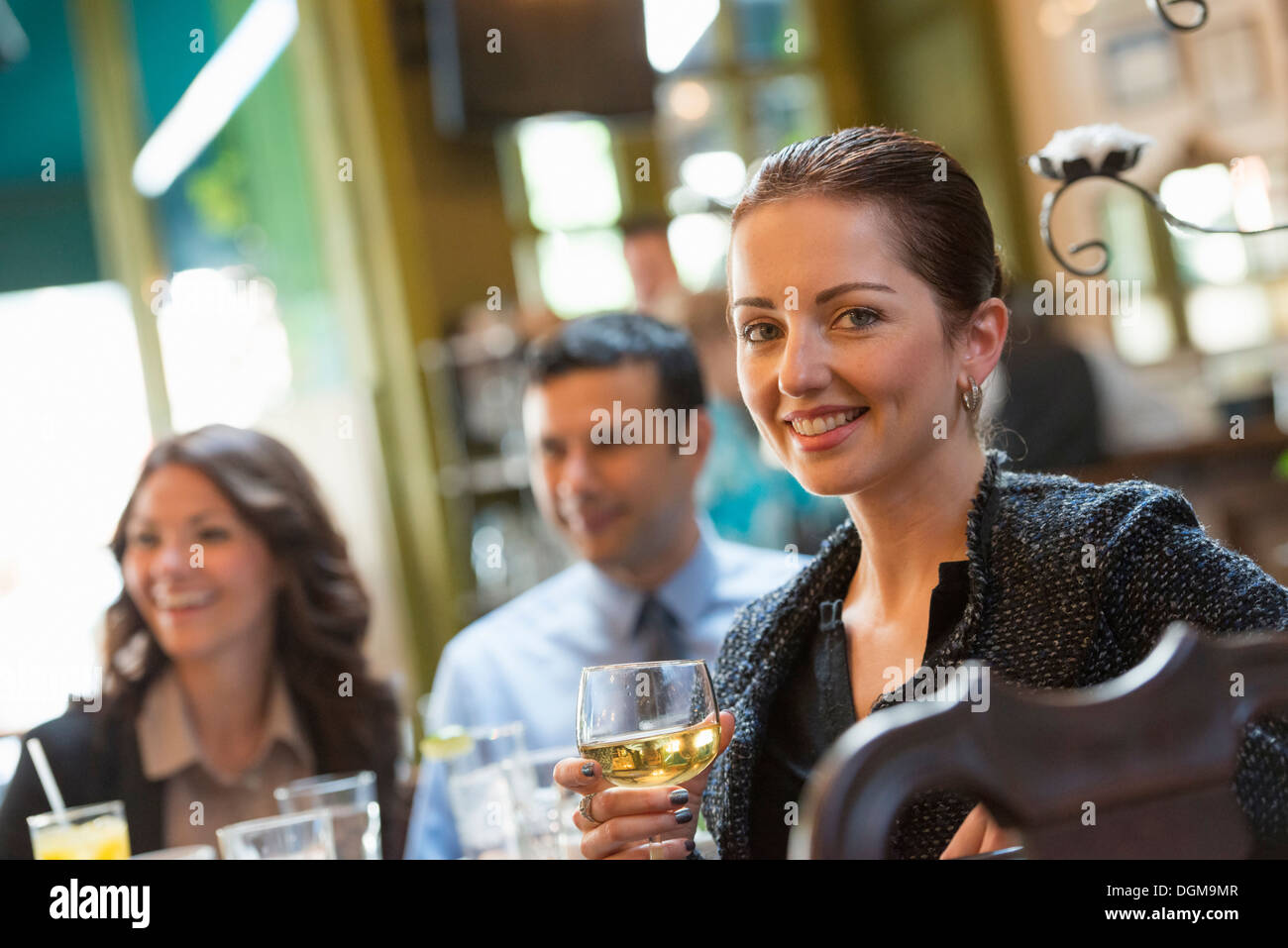Group people sitting around table hi-res stock photography and images ...