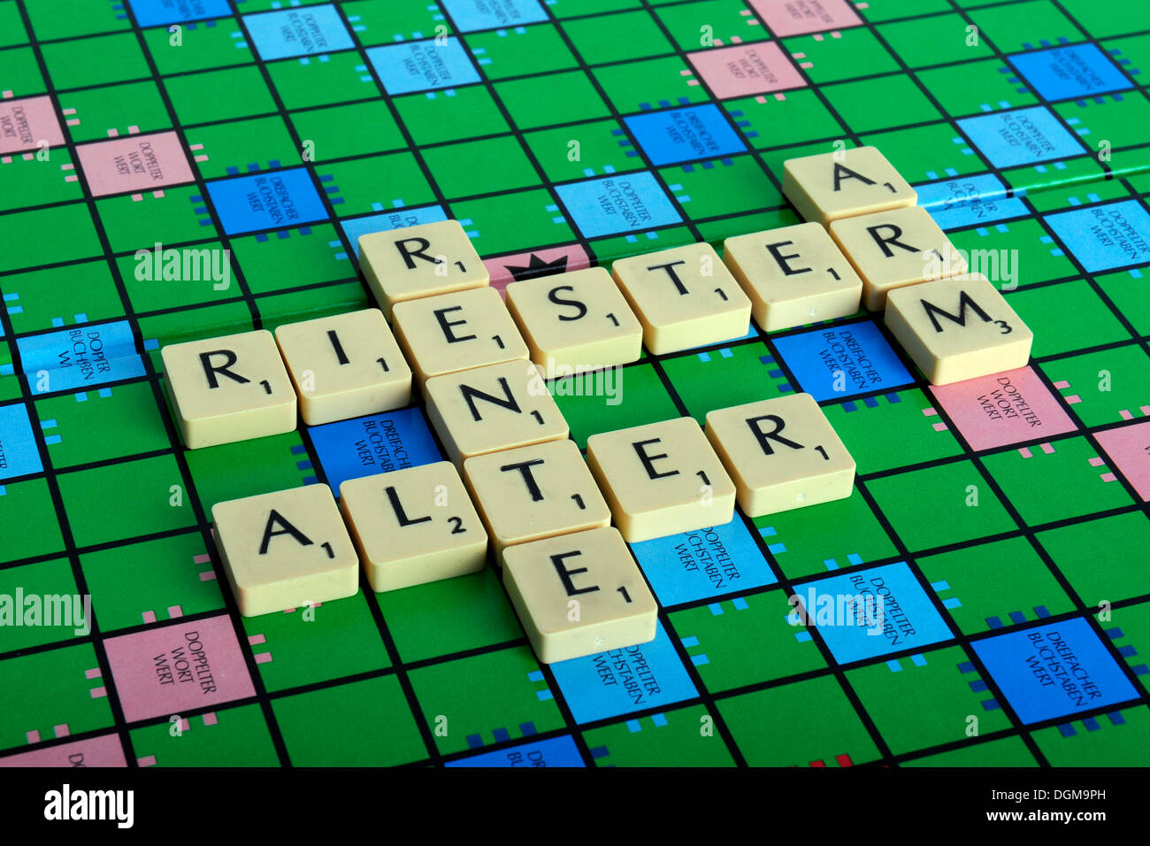Scrabble letters forming the words Riester, Rente, arm and Alter ...