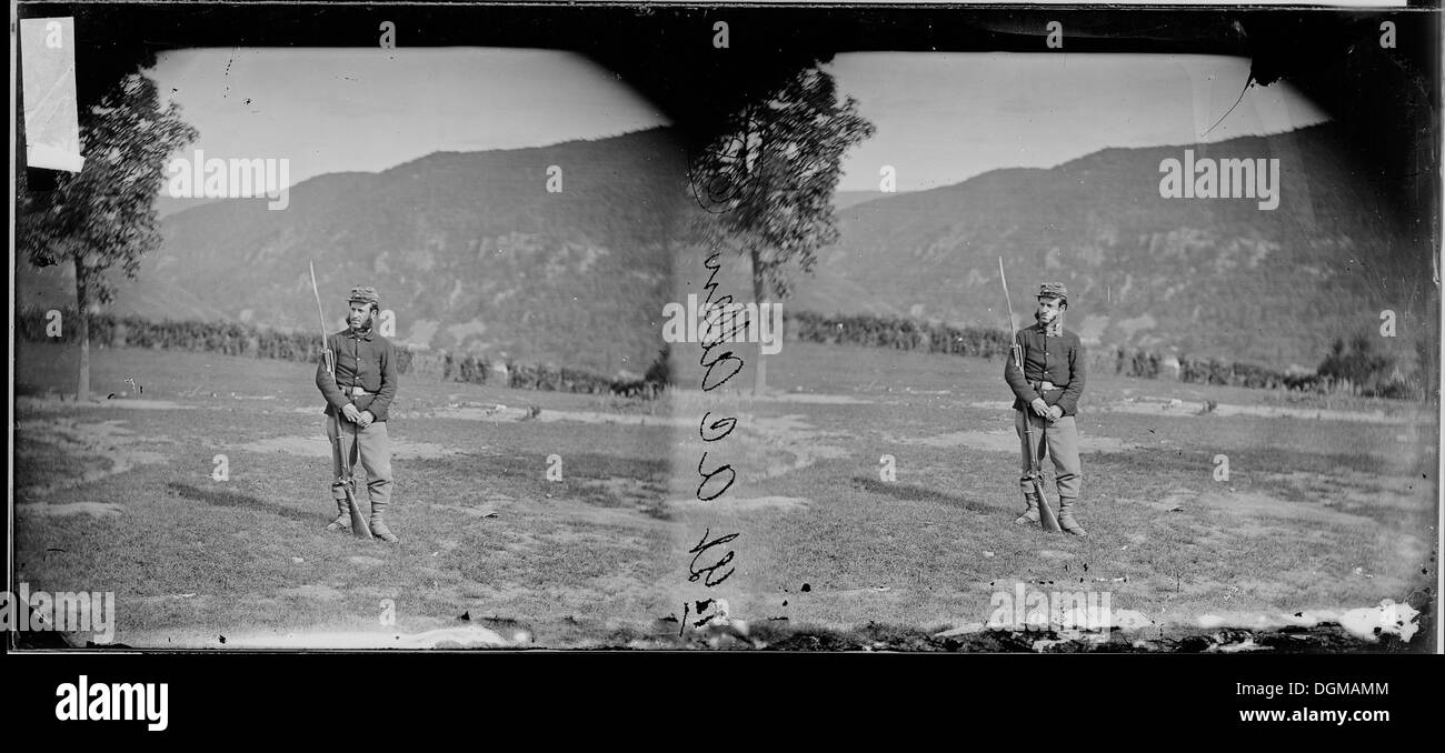 A private infantry soldier stands guard at a military post ...