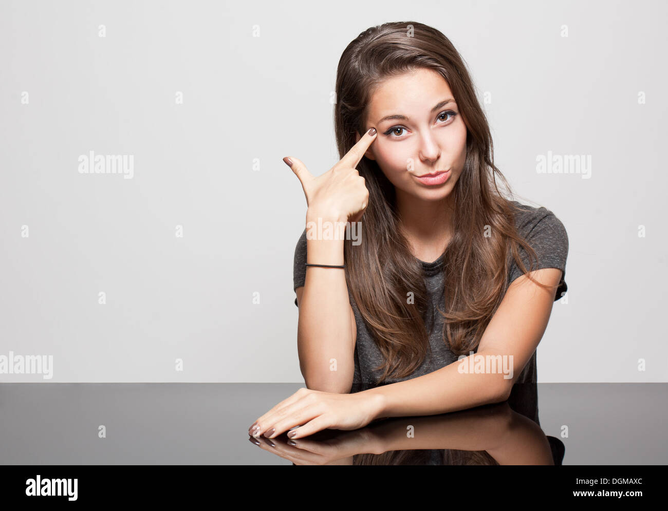 Portrait of beautiful young brunette woman with expressive gestures ...