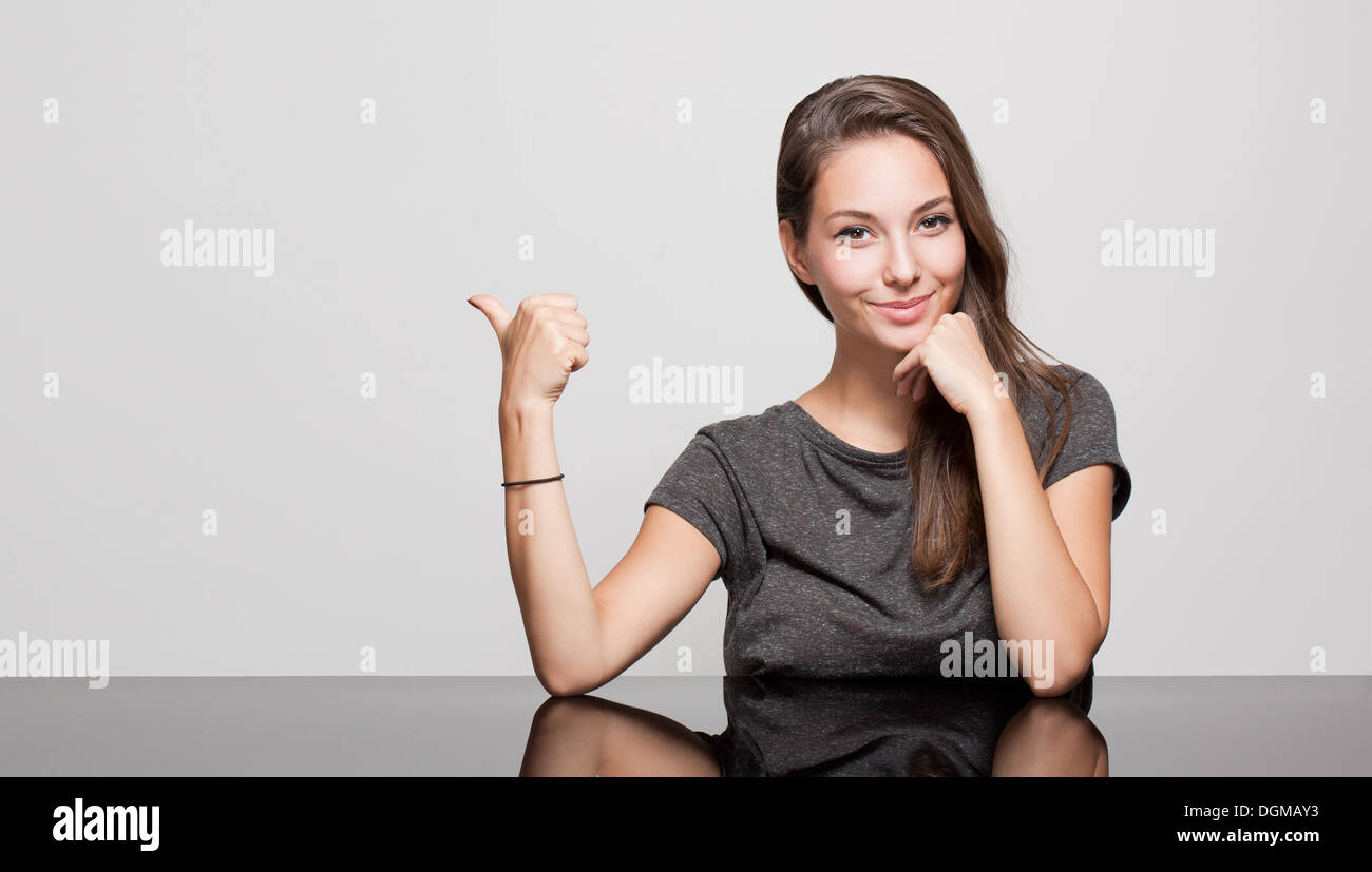Portrait of beautiful young brunette woman with expressive gestures ...