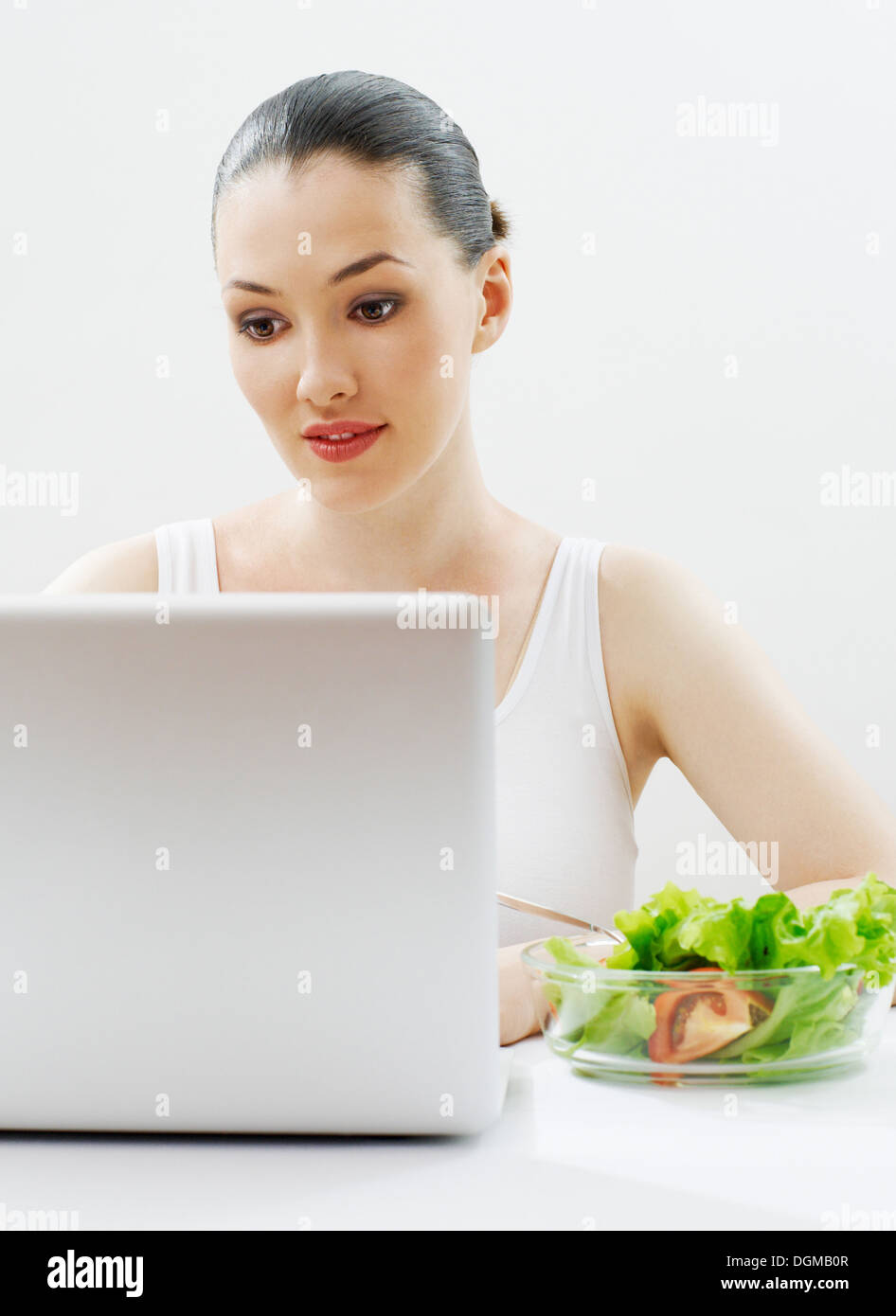 A beautiful slender girl eating healthy food Stock Photo - Alamy