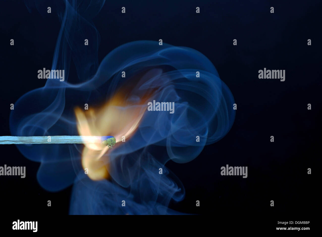 Matchstick being ignited, with blue smoke Stock Photo - Alamy