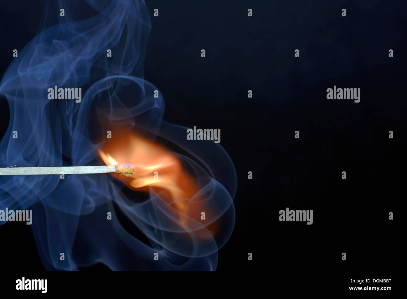 Matchstick being ignited, with blue smoke Stock Photo - Alamy