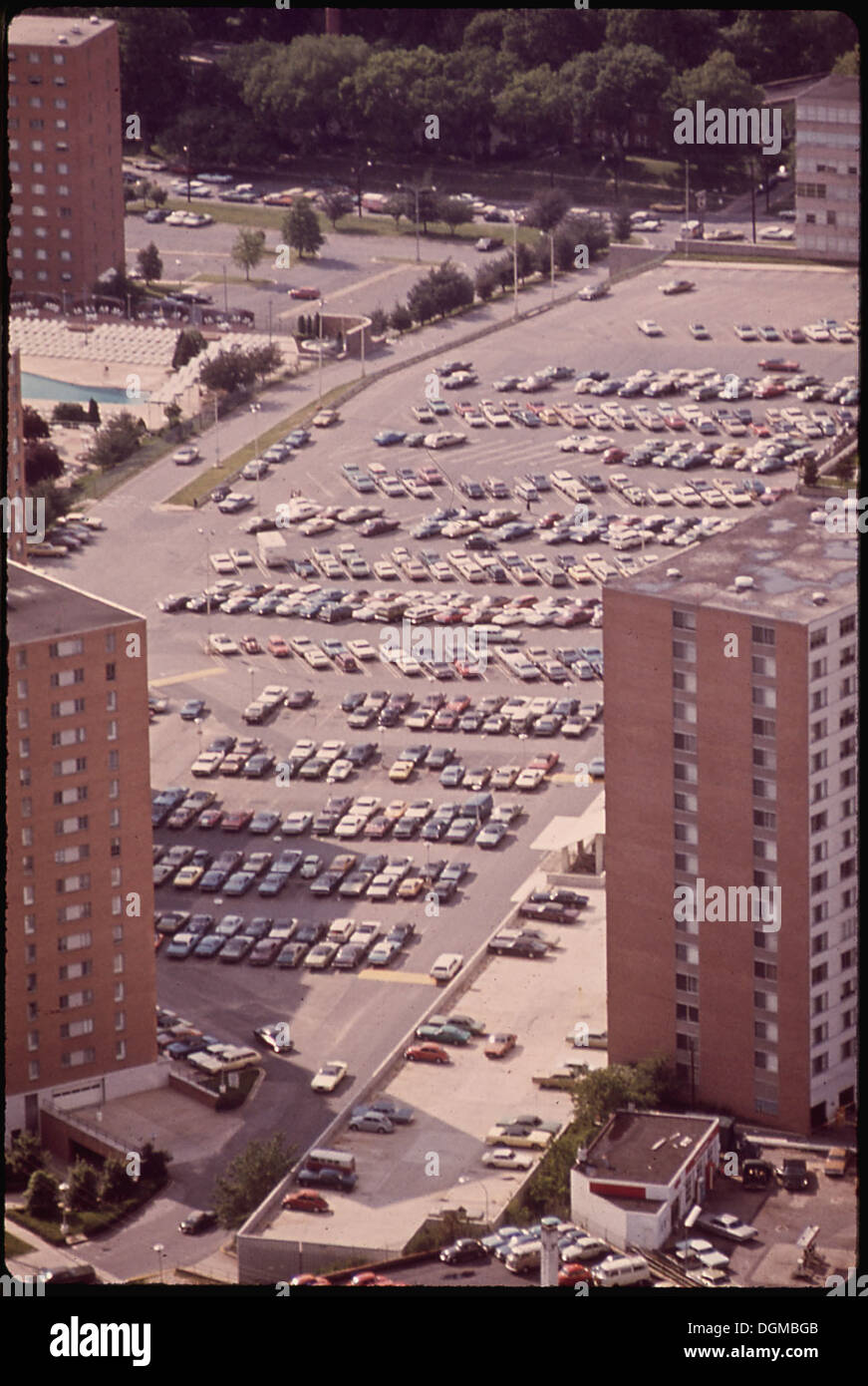 This image shows a suburban high-rise apartment parking facility ...