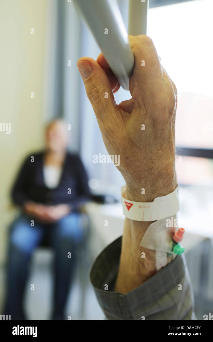 Elderly man in a hospital, detail, hand holding a hand grip in a ...
