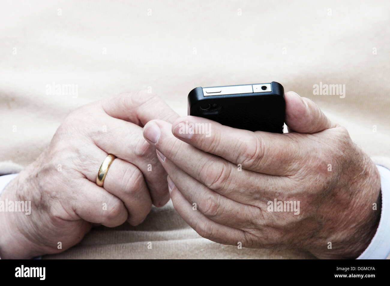 Hands holding smartphones typing hi-res stock photography and images ...