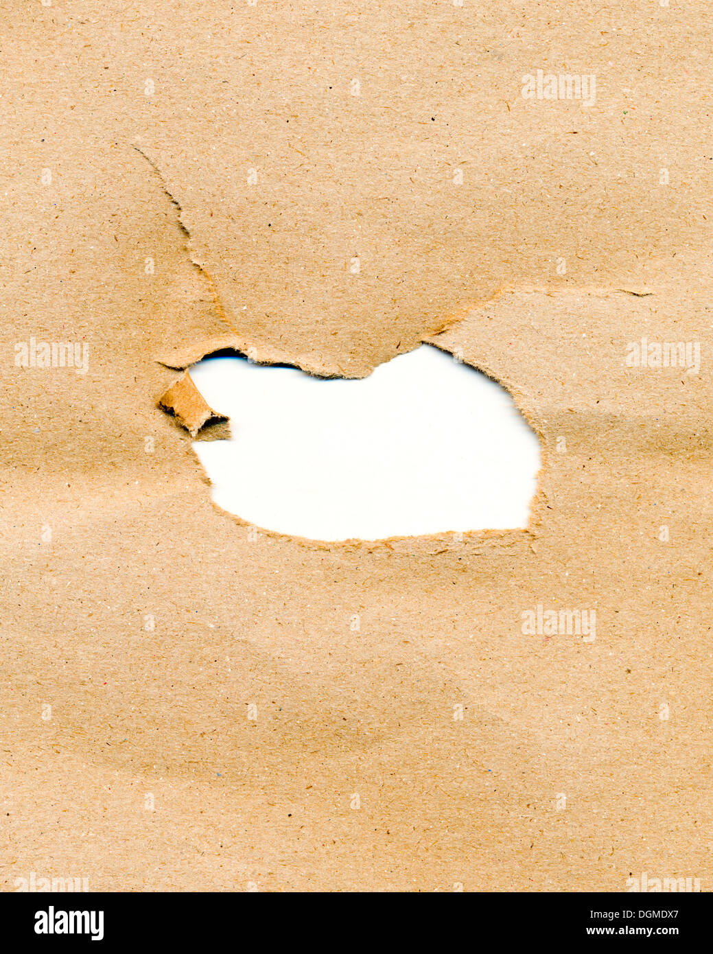 hole in kraft paper Stock Photo - Alamy