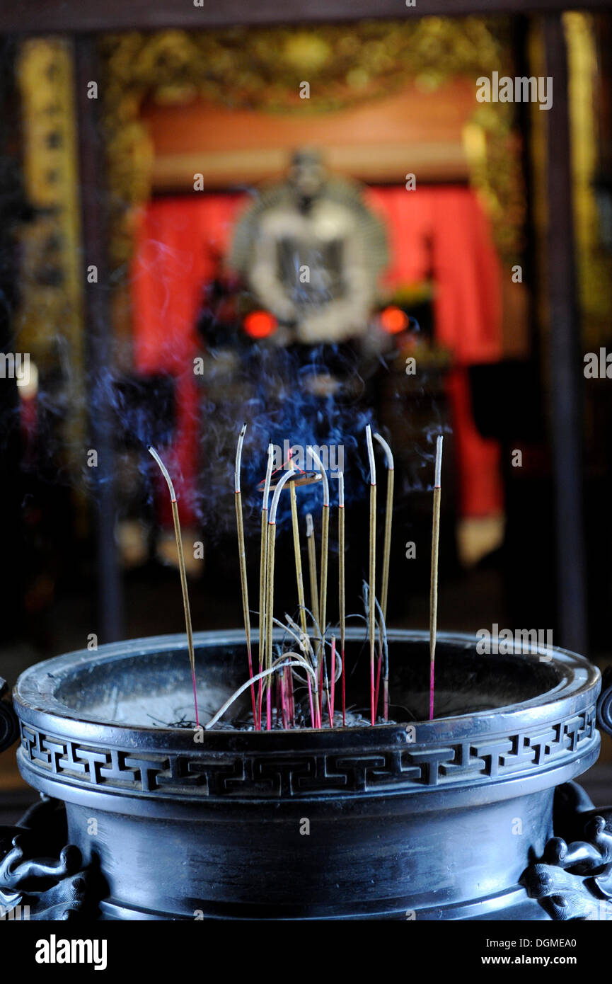 Bowl of incense in front of the figure of the first director Chu Van An ...