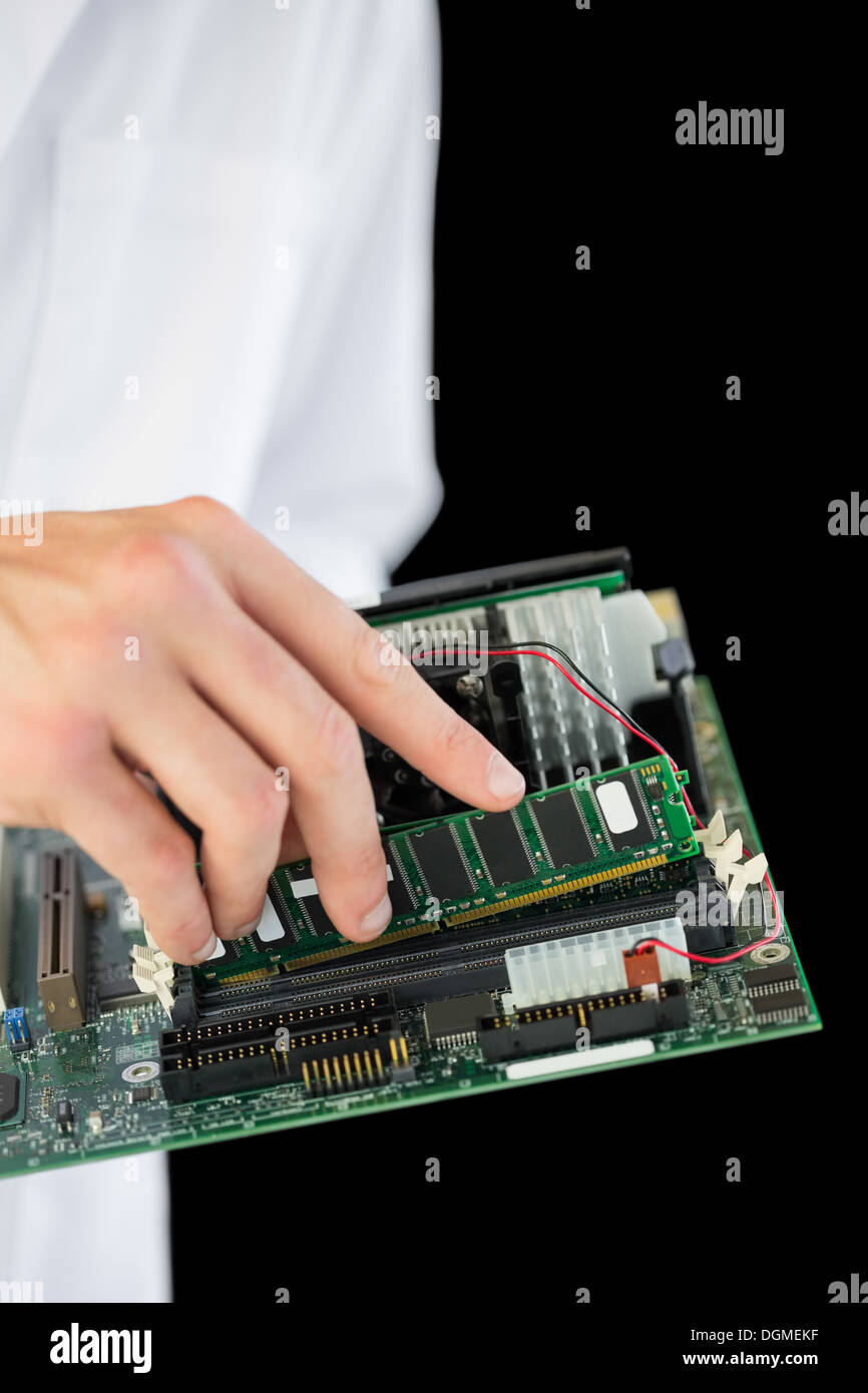 Extreme close up of computer engineer holding hardware at night Stock ...
